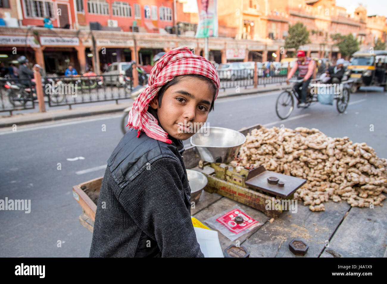 Portrait of a child selling ginger at the Johri Bazaar in Jaipur, India ...