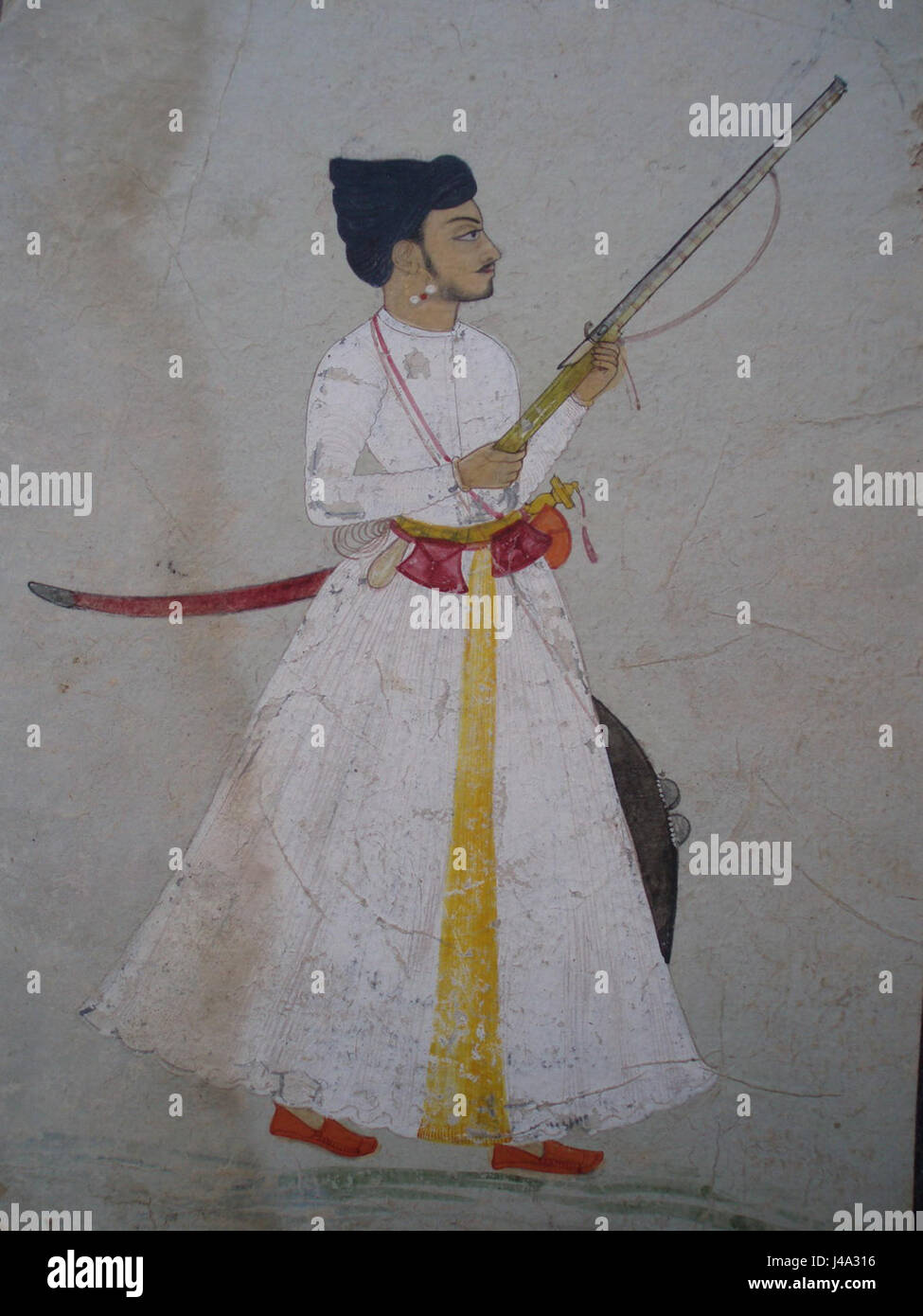 The title refers to an image or depiction of a prince holding a rifle ...