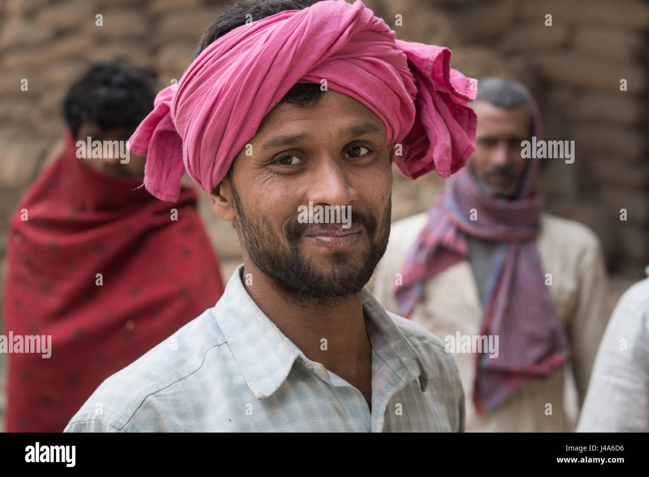 Worker smiling for a photo in New Delhi, India Stock Photo - Alamy