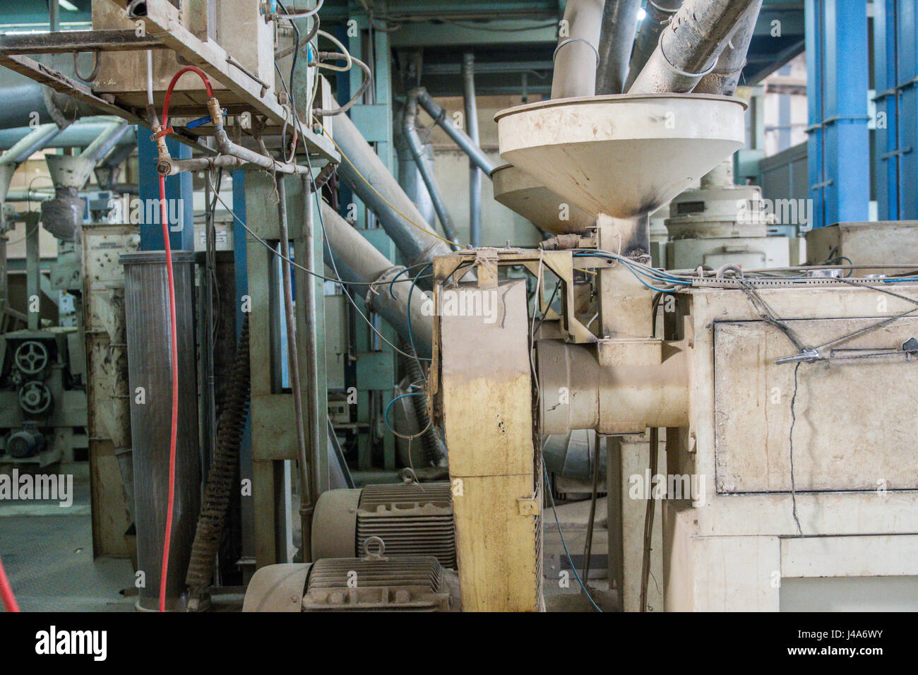 Machinery inside of a rice processing facility in New Delhi, India ...