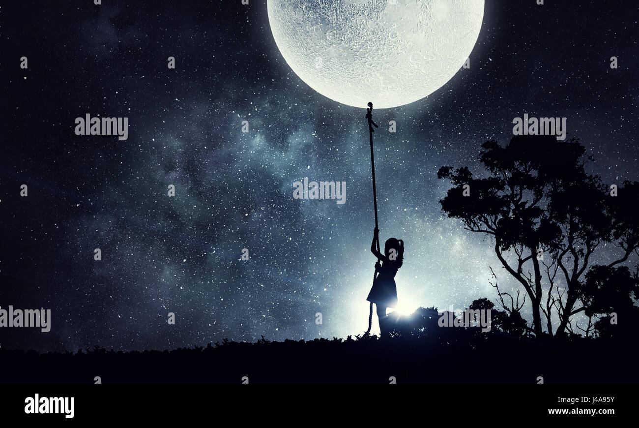 Kid girl catching moon Stock Photo - Alamy
