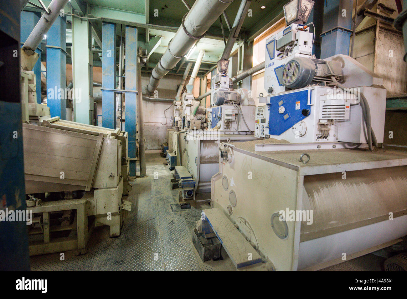 Machinery inside of a rice processing facility in New Delhi, India ...