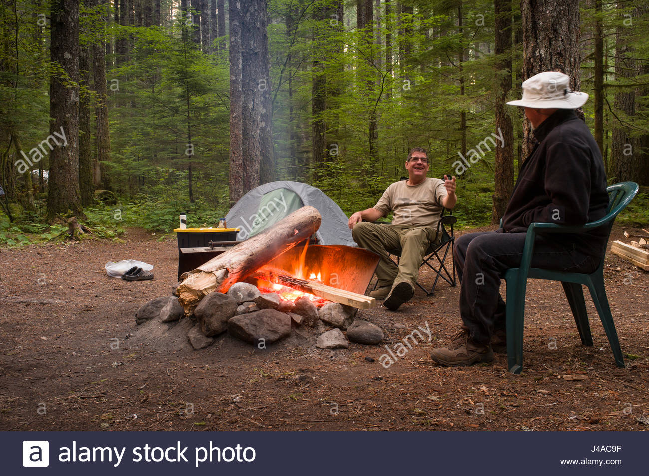 Sitting Around Fire Stock Photos & Sitting Around Fire Stock Images - Alamy