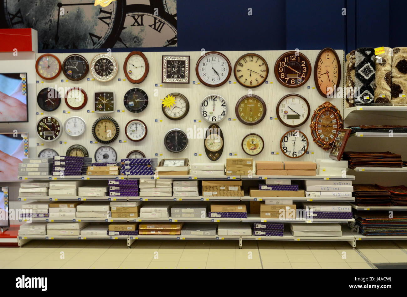 Wall Clocks in Supermarket Stock Photo - Alamy