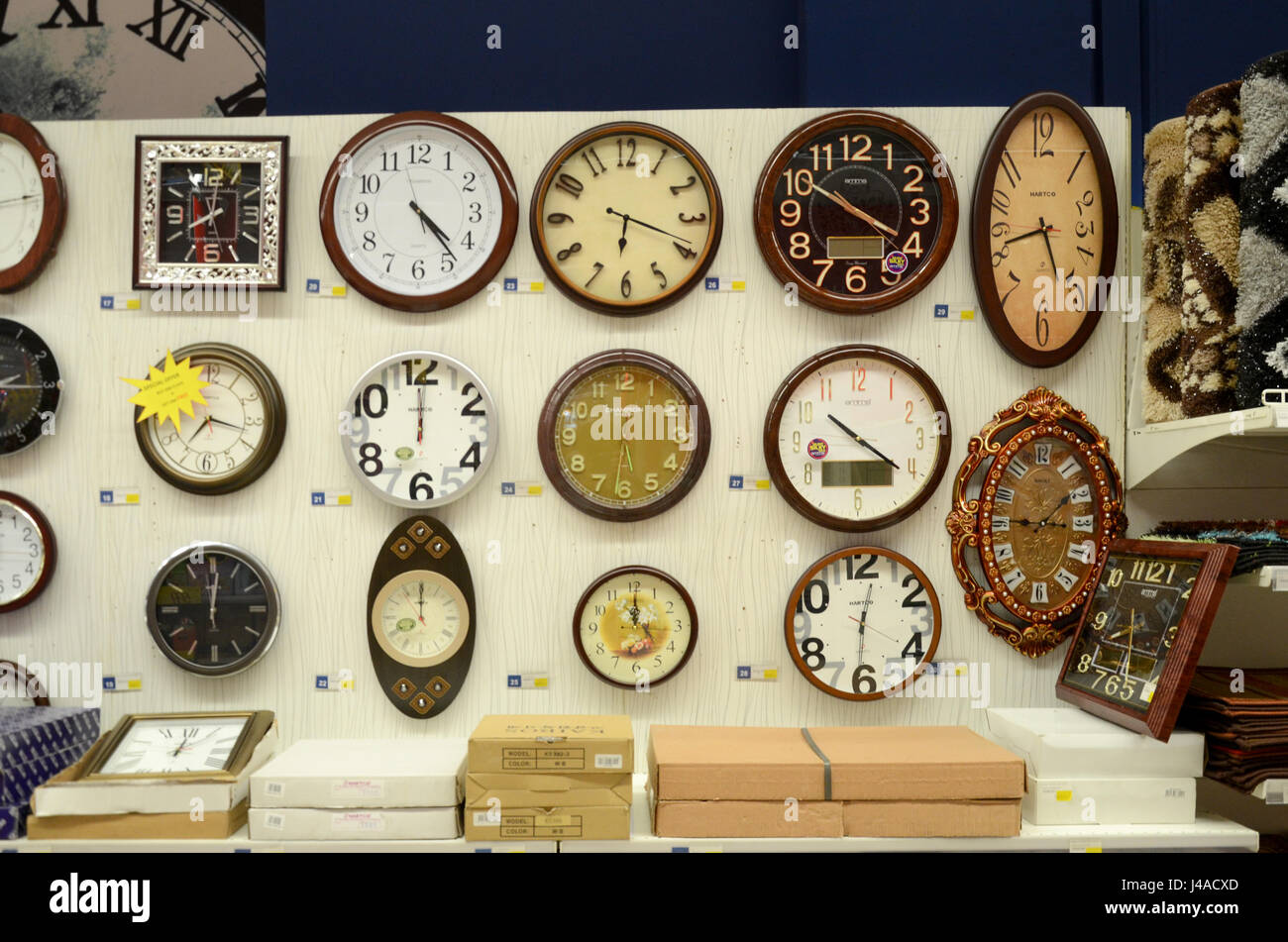Wall Clocks in Supermarket Stock Photo - Alamy