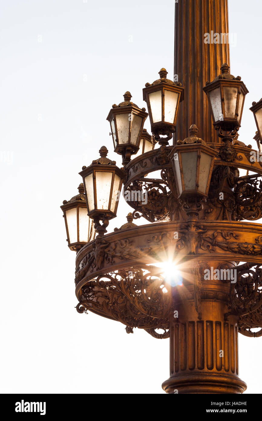 Early morning sun shines through a street lamp post in Berlin, Germany ...