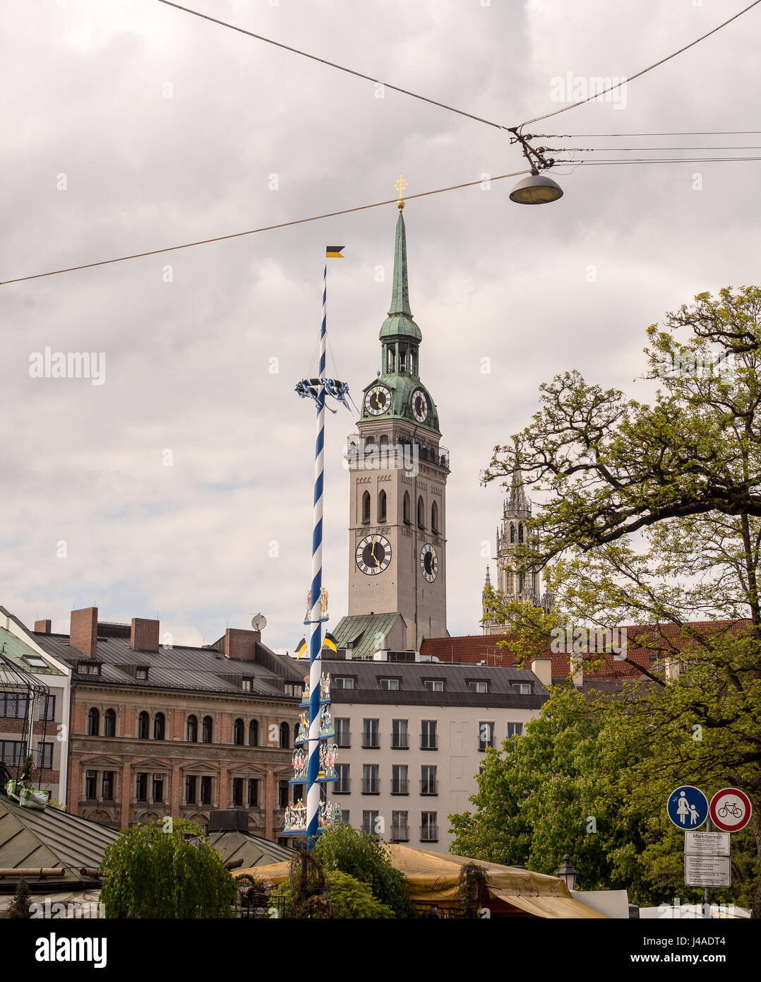 View of Munich's Maypole with St. Peter's Church and City Hall's towers ...