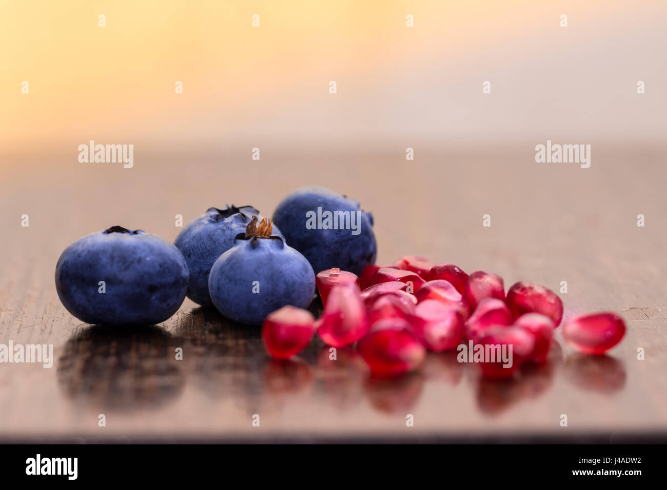 freshly farm picked blue berries closeup with pomegranate seeds Stock ...
