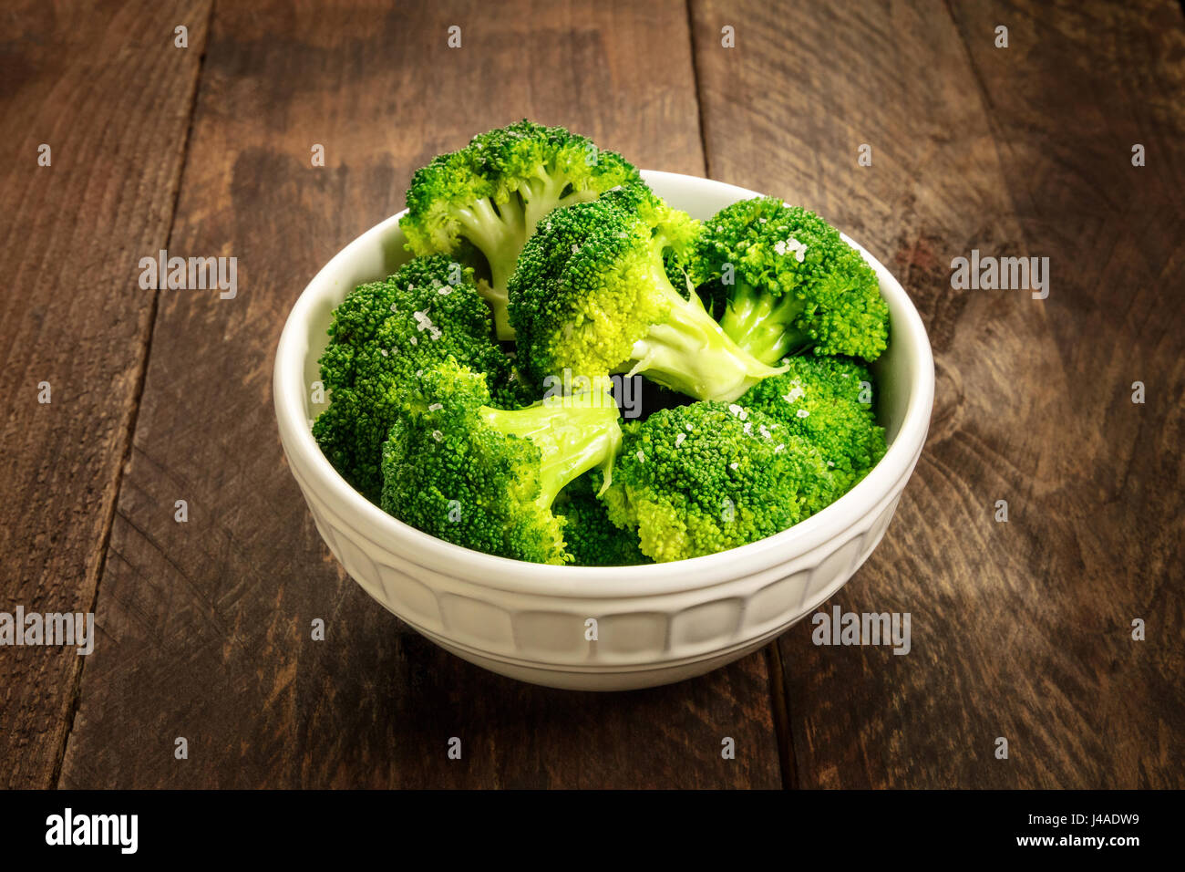 Cooked green broccoli with sea salt and copyspace Stock Photo - Alamy