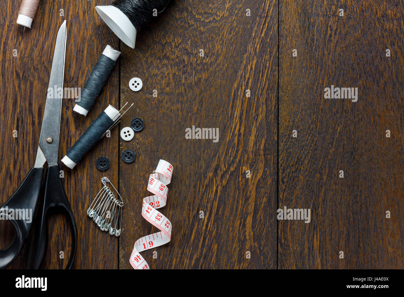 Top view tailor items on wooden background with copy space Stock Photo ...