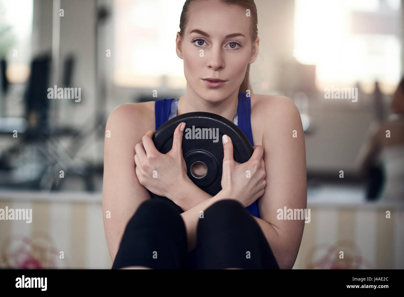 Pair of young adult women doing abdominal muscle Russian twist ...