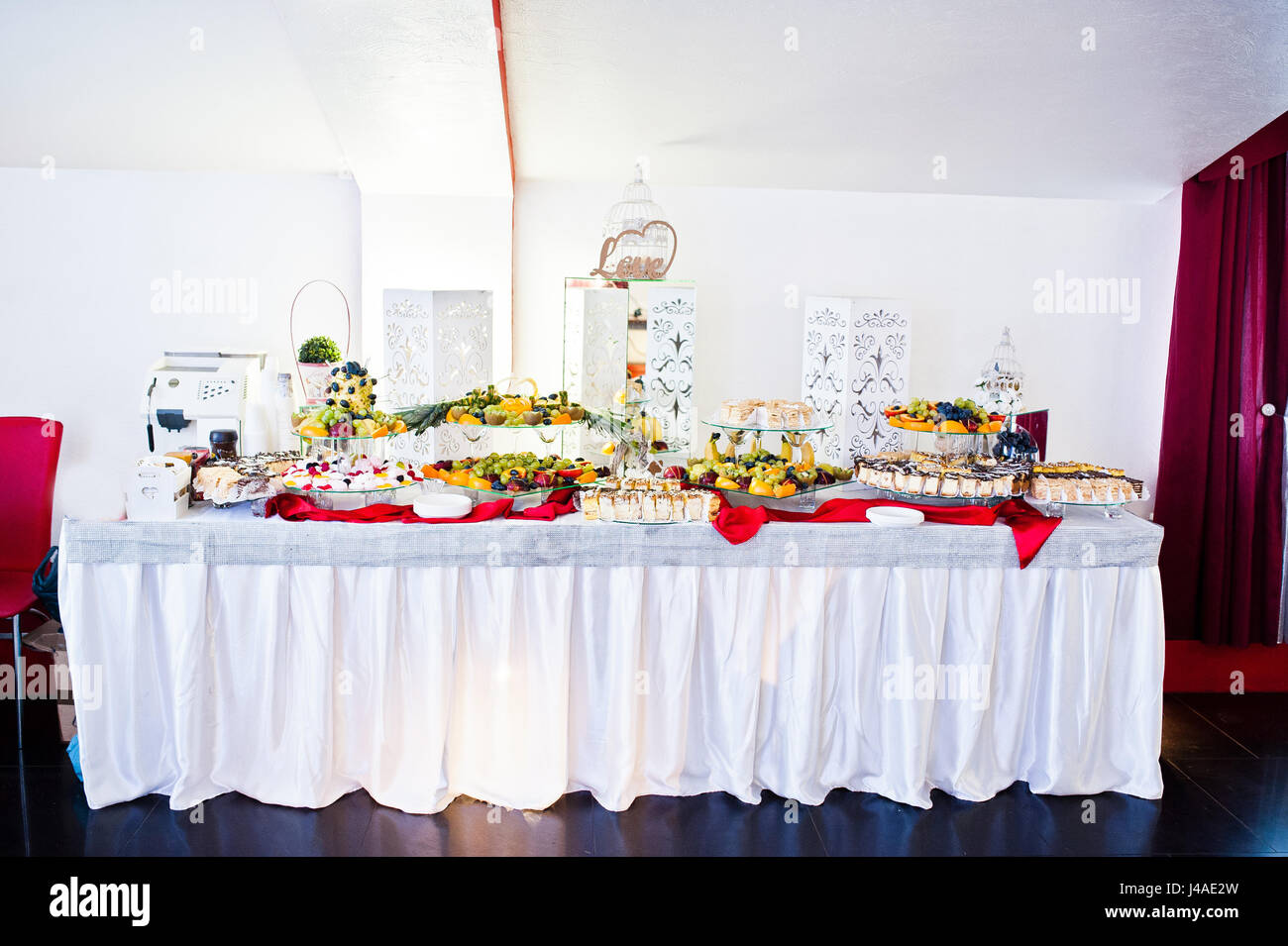 Wedding reception catering table with different fruits and cakes Stock ...