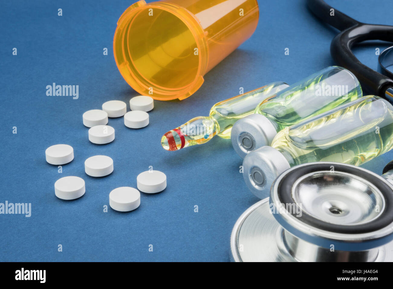 stethoscope, pills, vials in medical room on blue background Stock ...