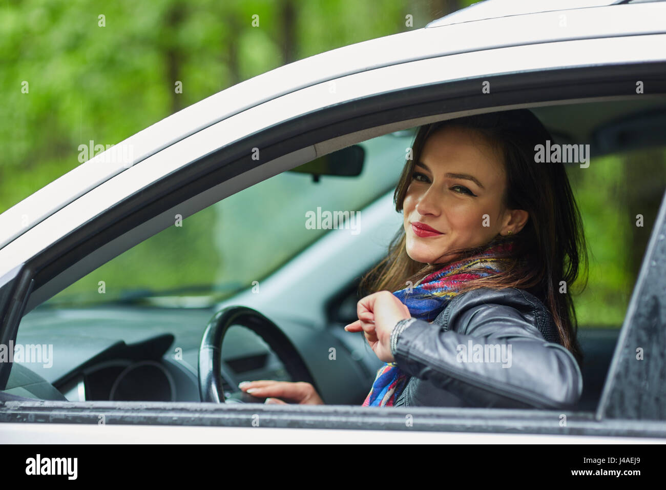 Portrait of a young woman with her new car Stock Photo - Alamy