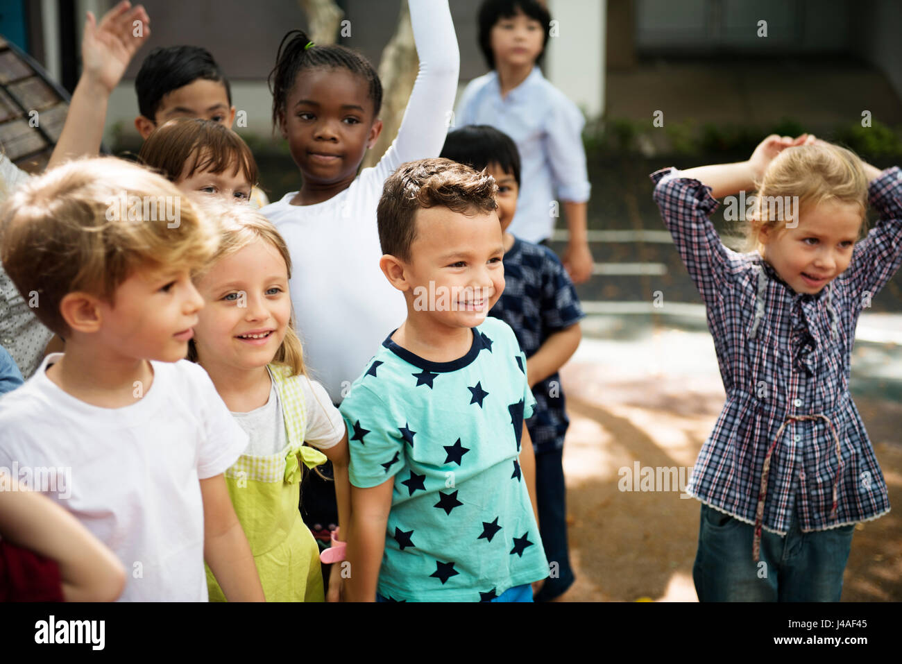 Diverse kids standing together Stock Photo - Alamy