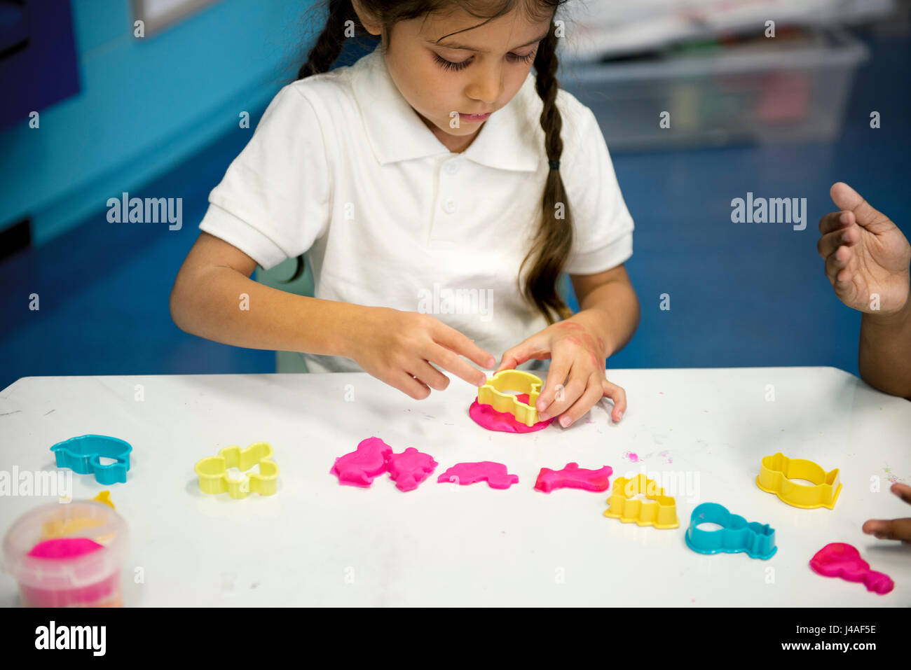 Kindergarten students learning shape with colorful clay Stock Photo - Alamy