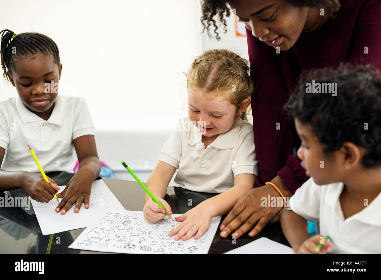 Group of diverse students drawing in art class Stock Photo - Alamy