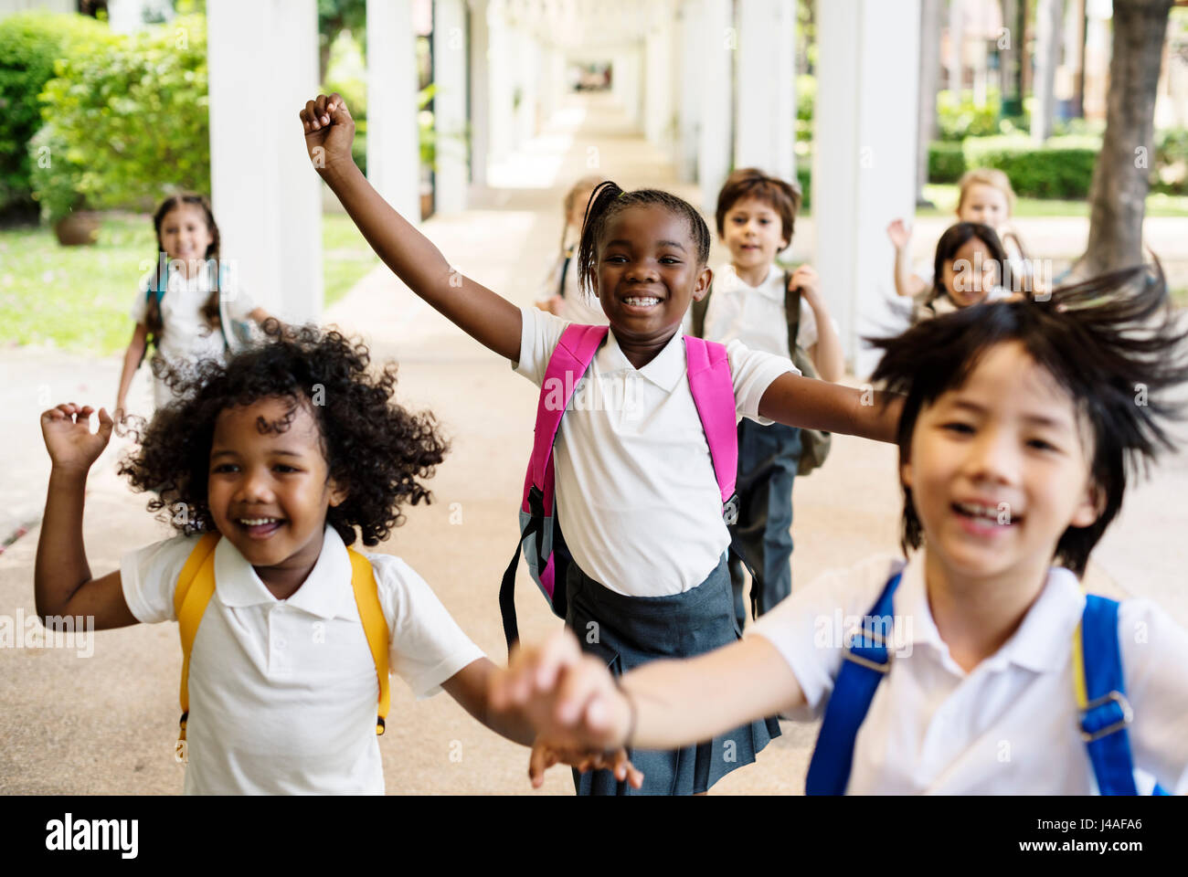 Group of diverse kindergarten students running cheerful after school ... Group of diverse kindergarten students running cheerful after school ...