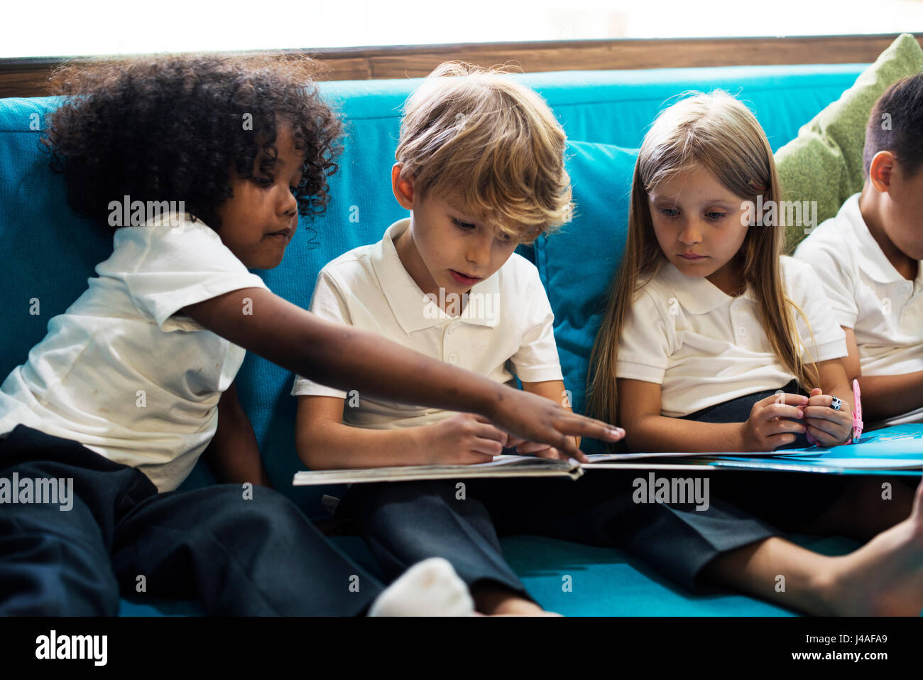 Diverse Children Reading Book High Resolution Stock Photography and ...