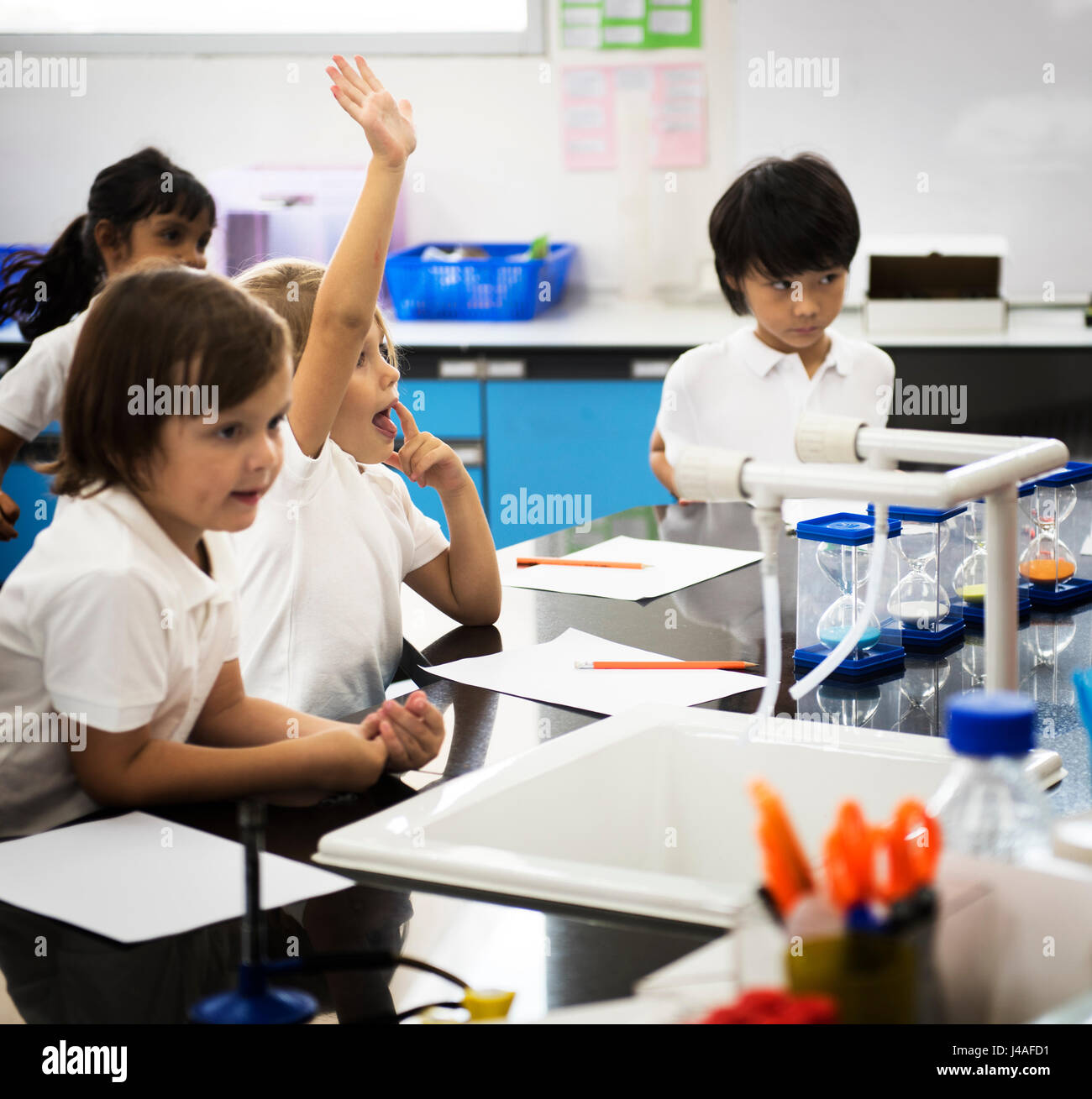 Diverse kindergarten students learning study in classroom Stock Photo ...