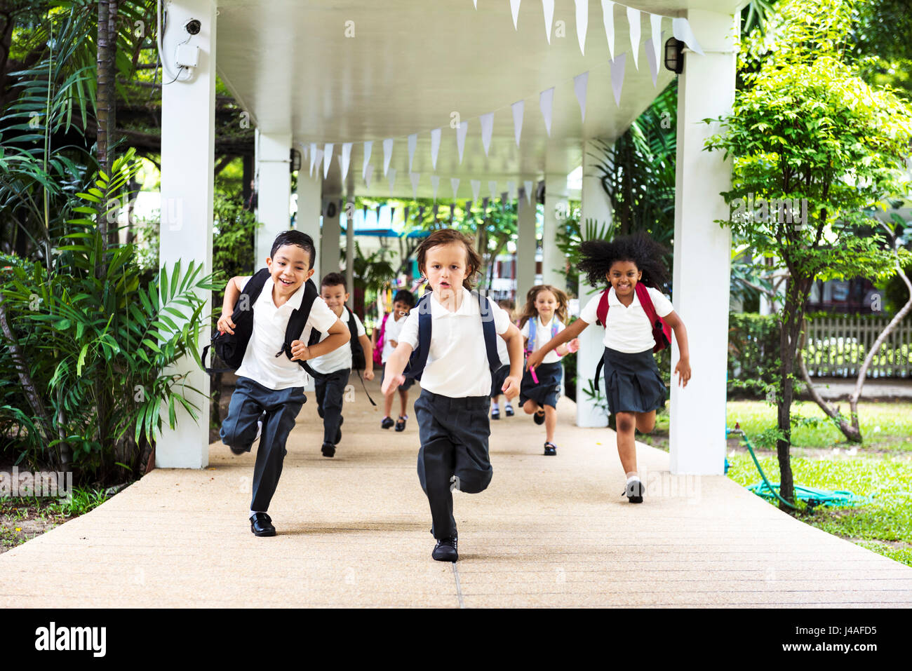 Group of diverse kindergarten students running cheerful after school ... Group of diverse kindergarten students running cheerful after school ...