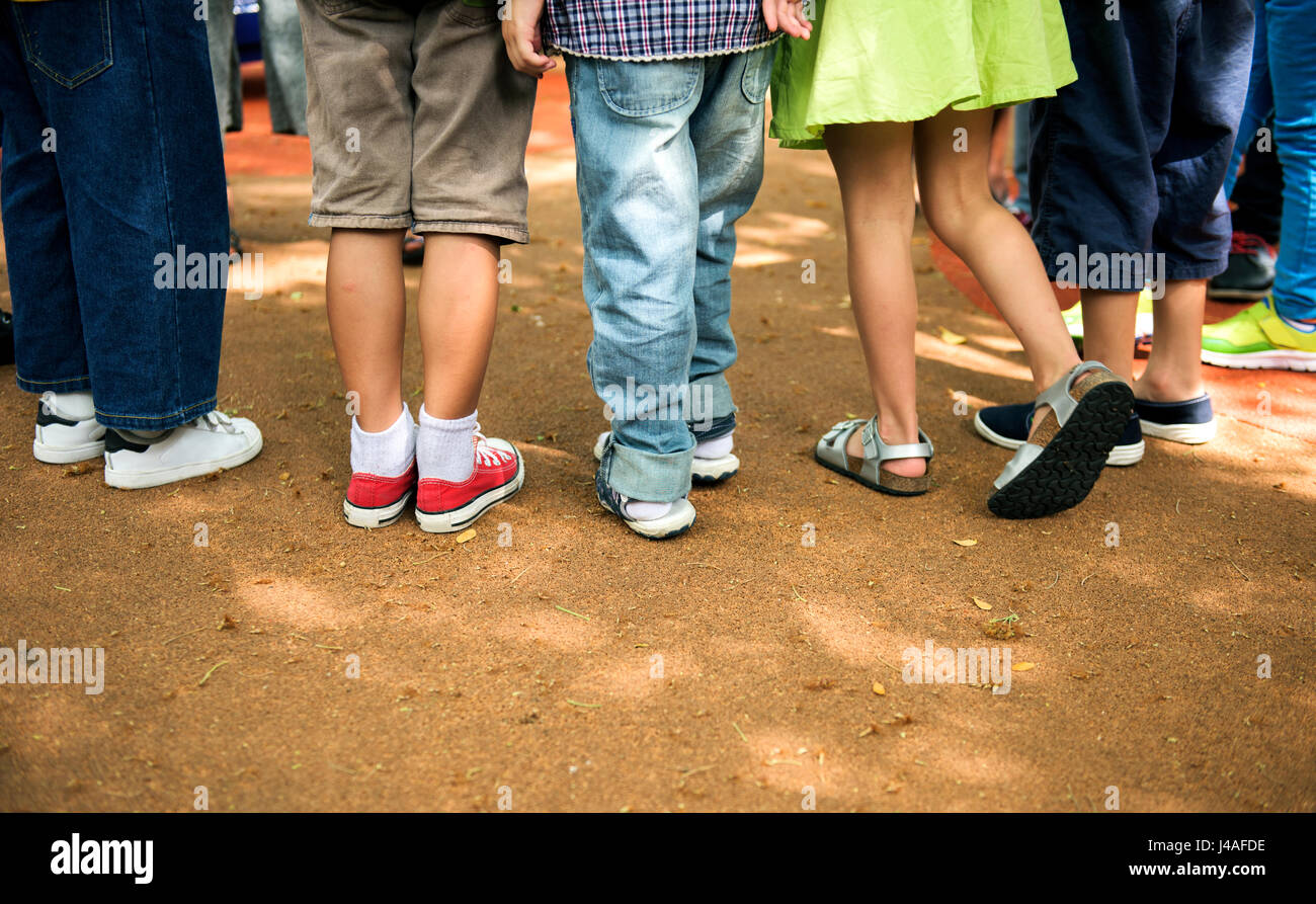 Diverse kids standing together outdoors Stock Photo - Alamy