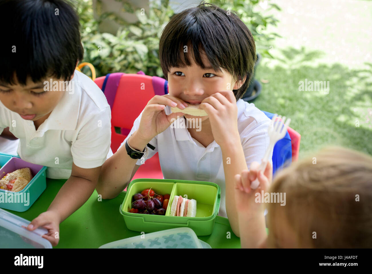 Diverse group of children eating hi-res stock photography and images ...