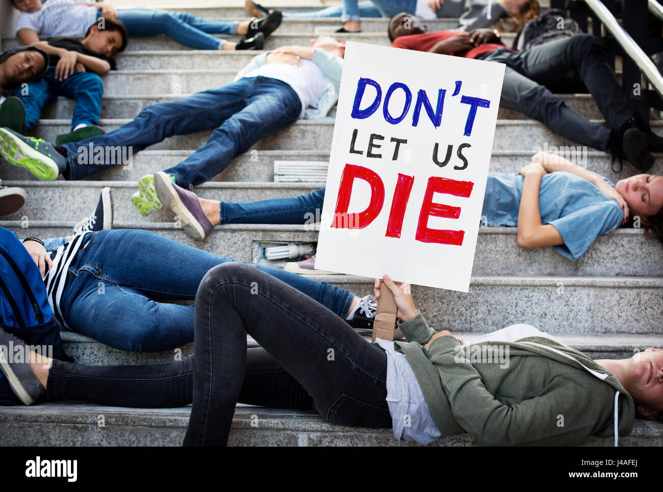 Group of students protest lying down on the staircase Stock Photo - Alamy