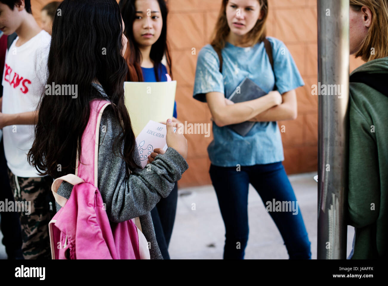 Girls friends talking together on staircase Stock Photo - Alamy