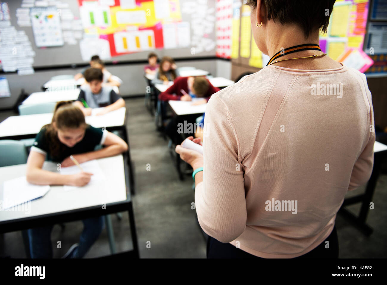 Students doing the exam in classroom Stock Photo - Alamy