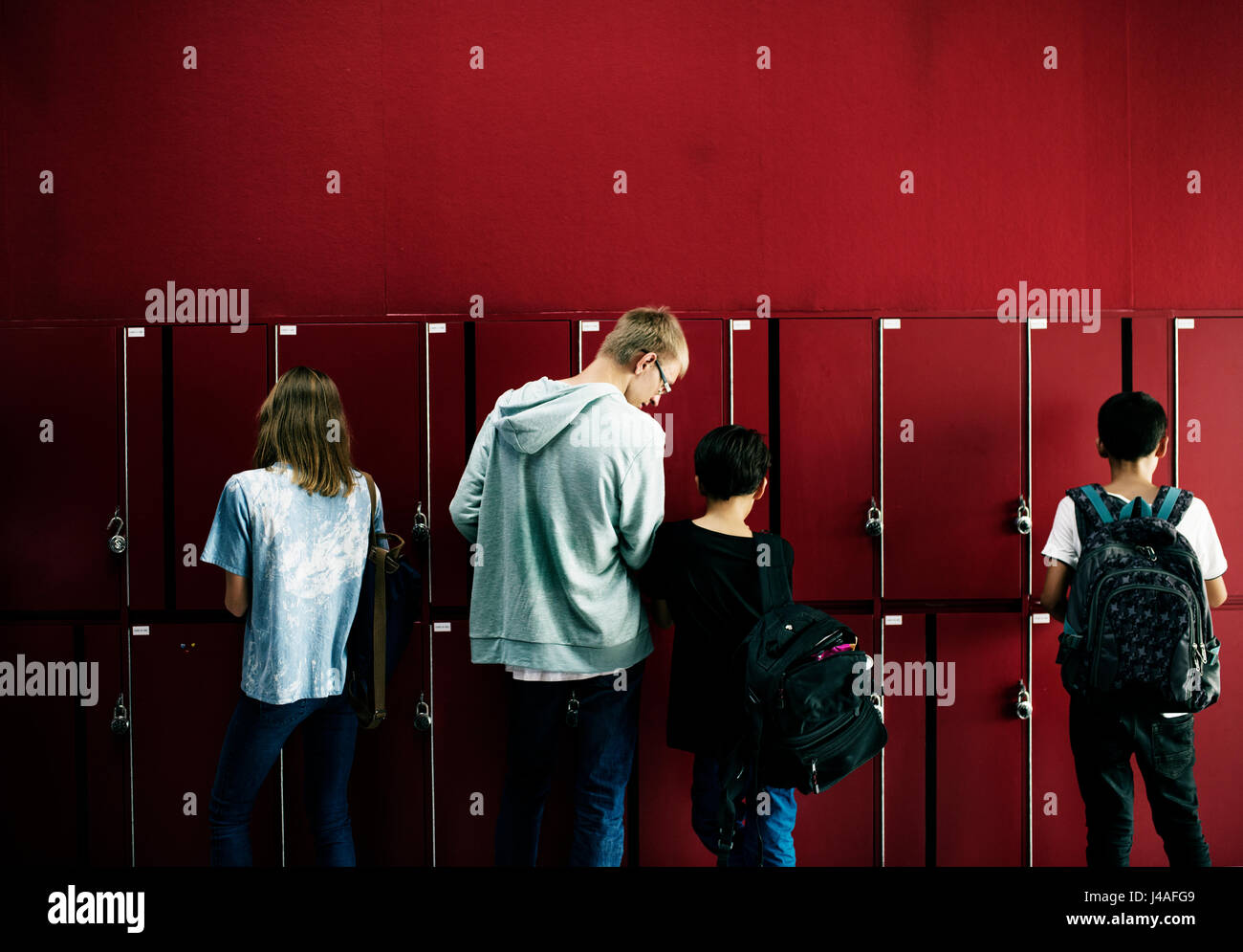 Students friends at lockers room Stock Photo - Alamy