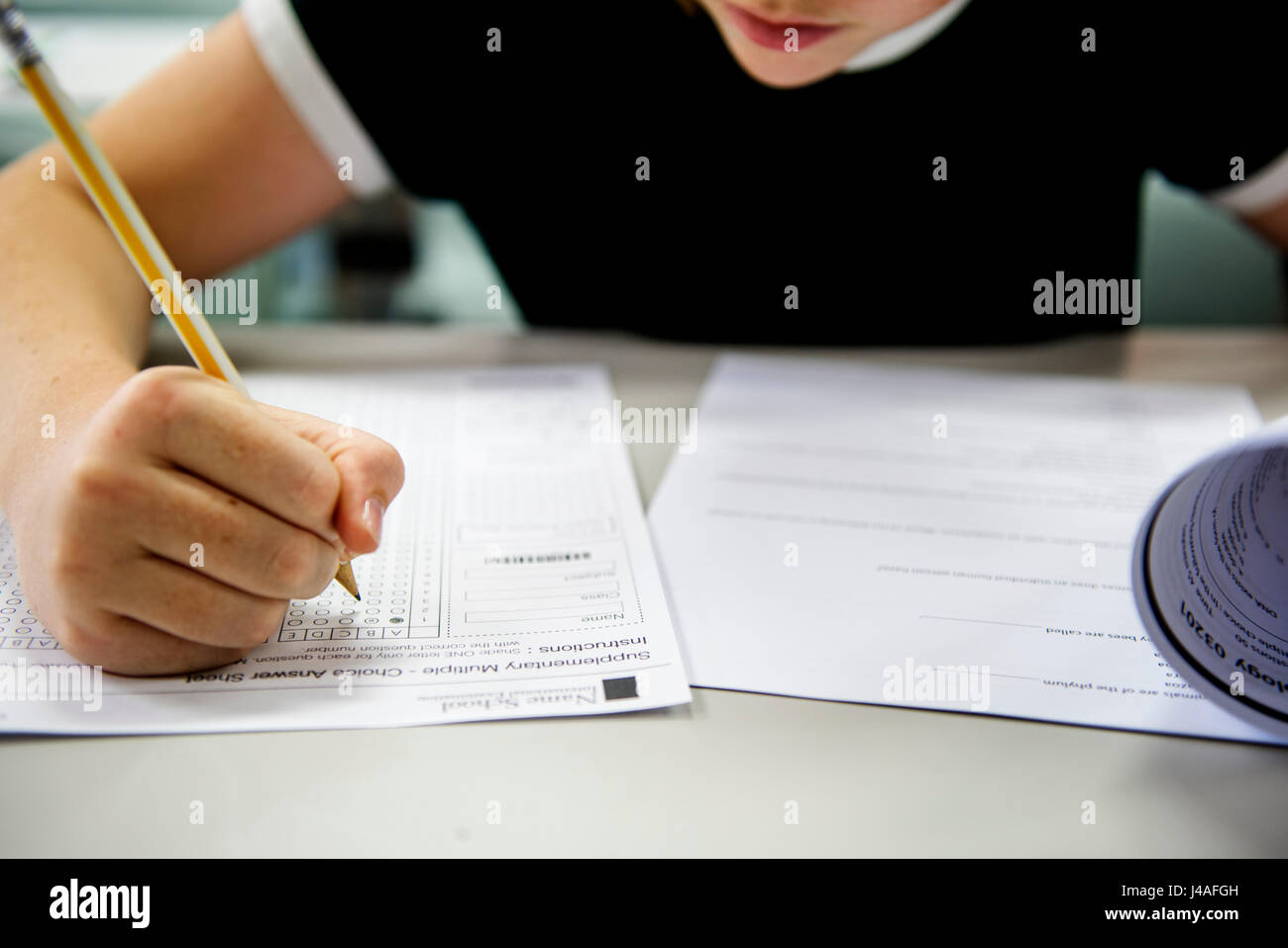 Student doing the test exam Stock Photo - Alamy