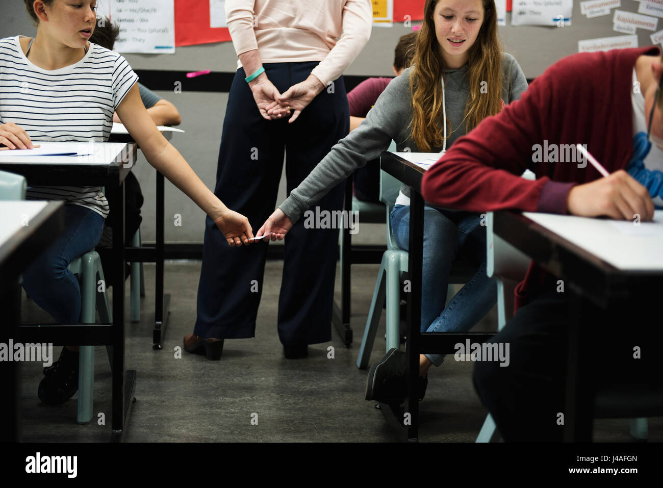 Women students cheating the exam Stock Photo - Alamy