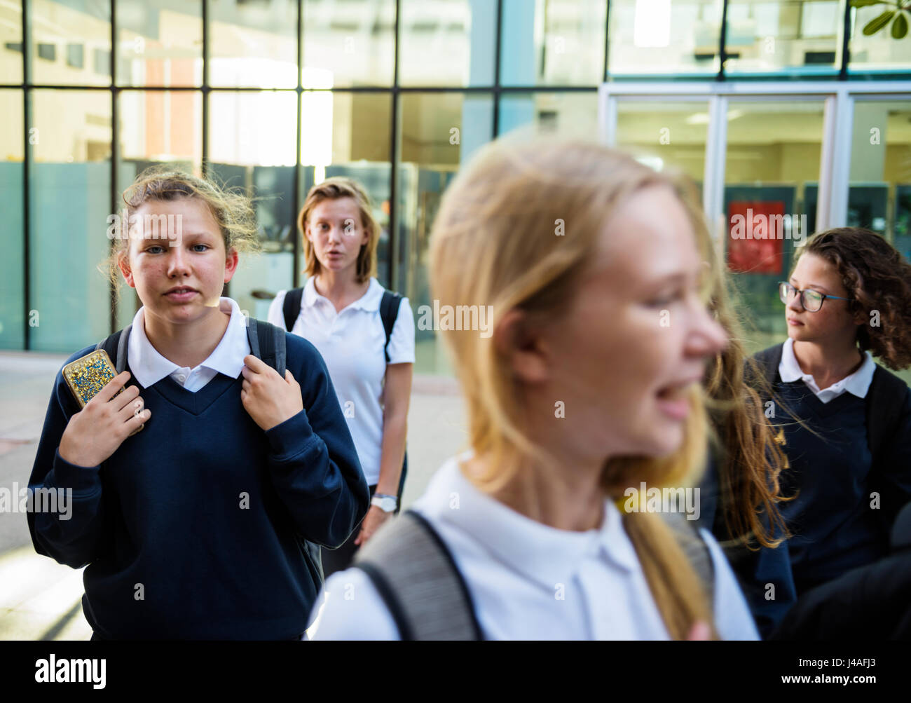 Group of students walking at school Stock Photo - Alamy