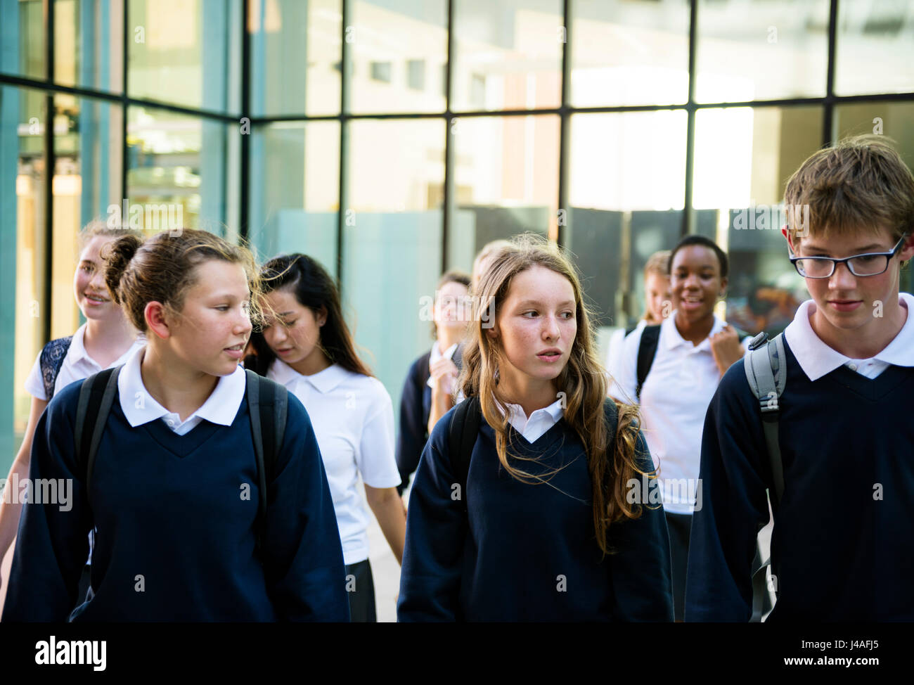 Group of students walking at school Stock Photo - Alamy
