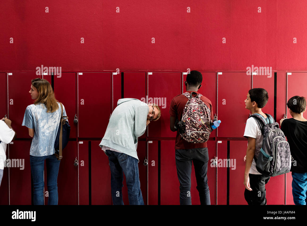 Students friends at lockers room Stock Photo - Alamy