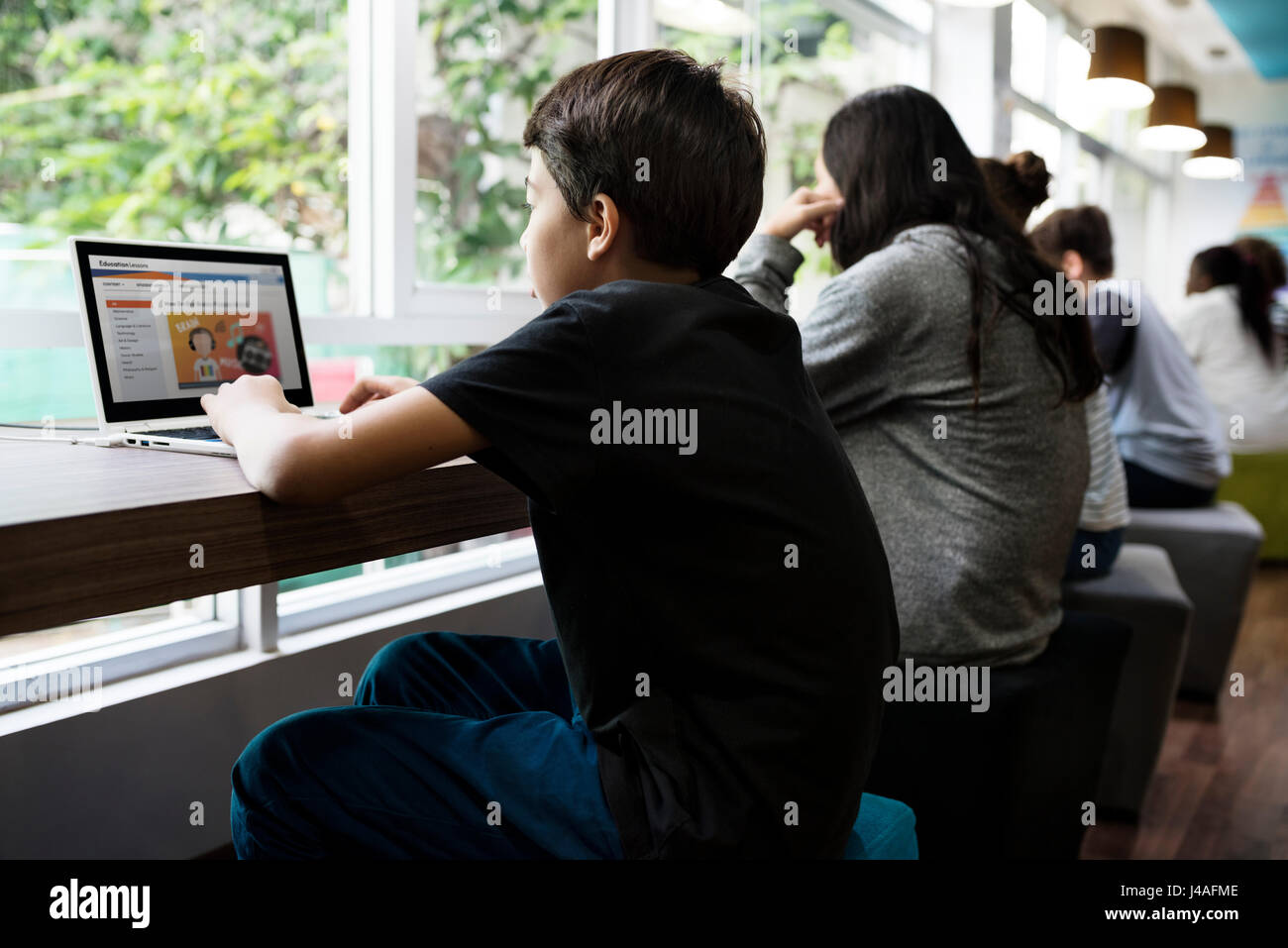 Group of students using laptop Stock Photo - Alamy