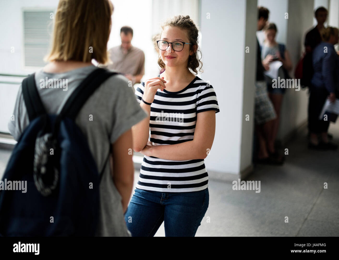 Women standing talking hi-res stock photography and images - Alamy