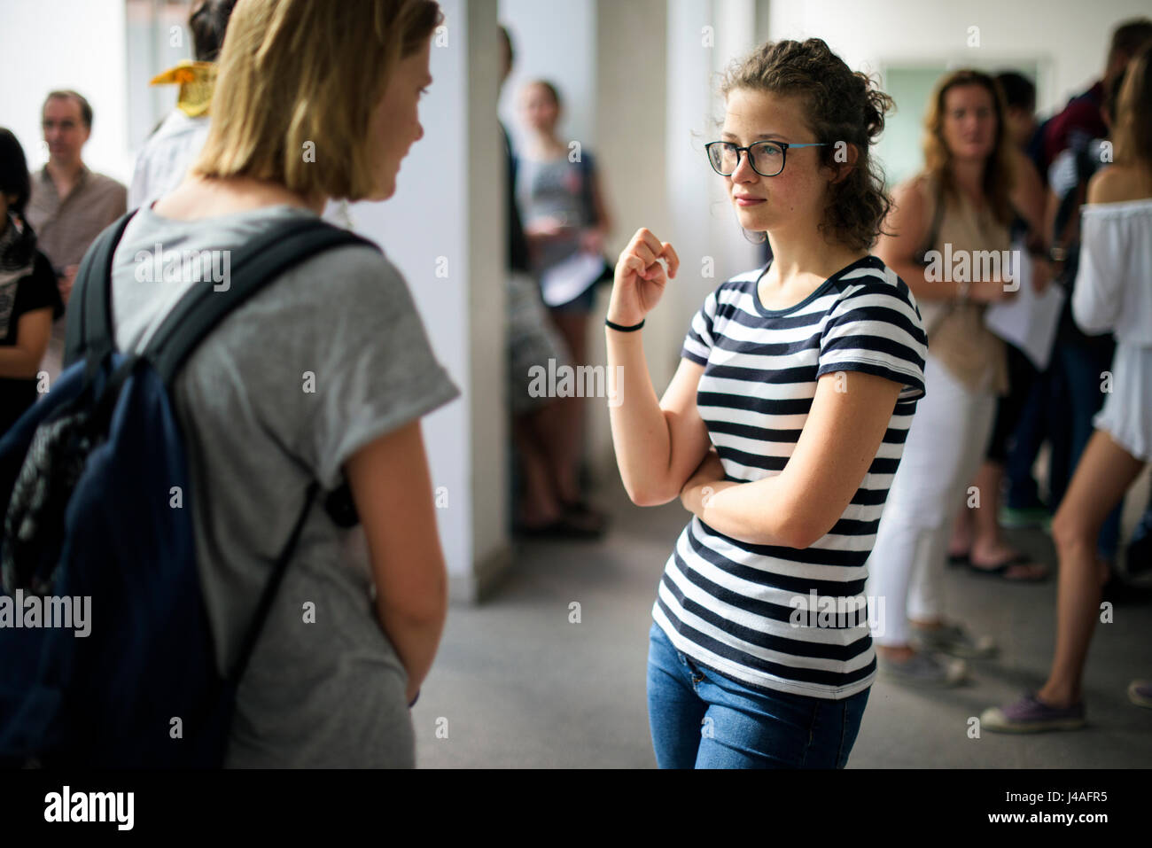 Women standing talking hi-res stock photography and images - Alamy