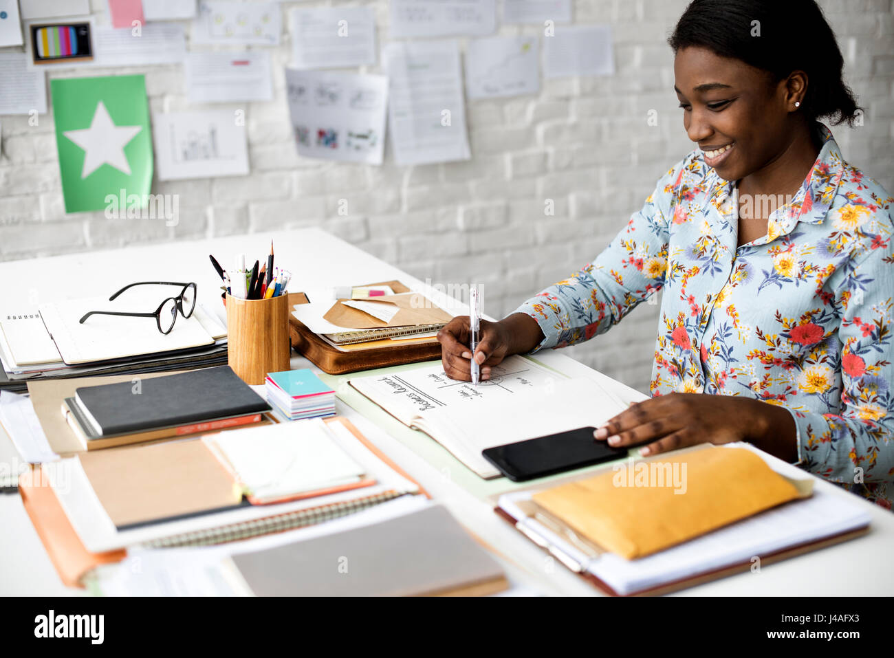 Hands Working on Office Desk with Notebooks and Stationery on White ...