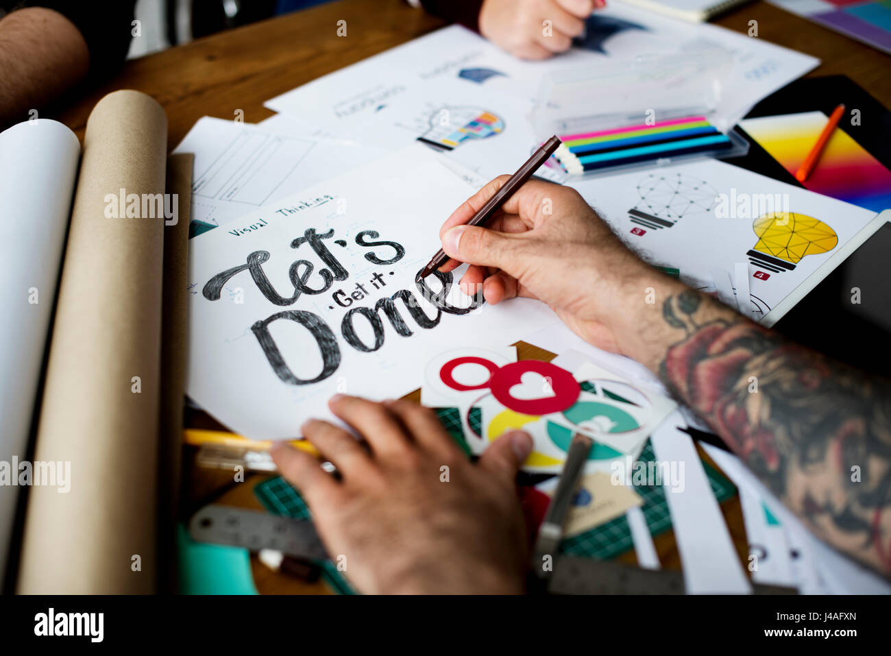 Hands Writing Let's Get It Done Pharse on Paper Art Design Stock Photo ...