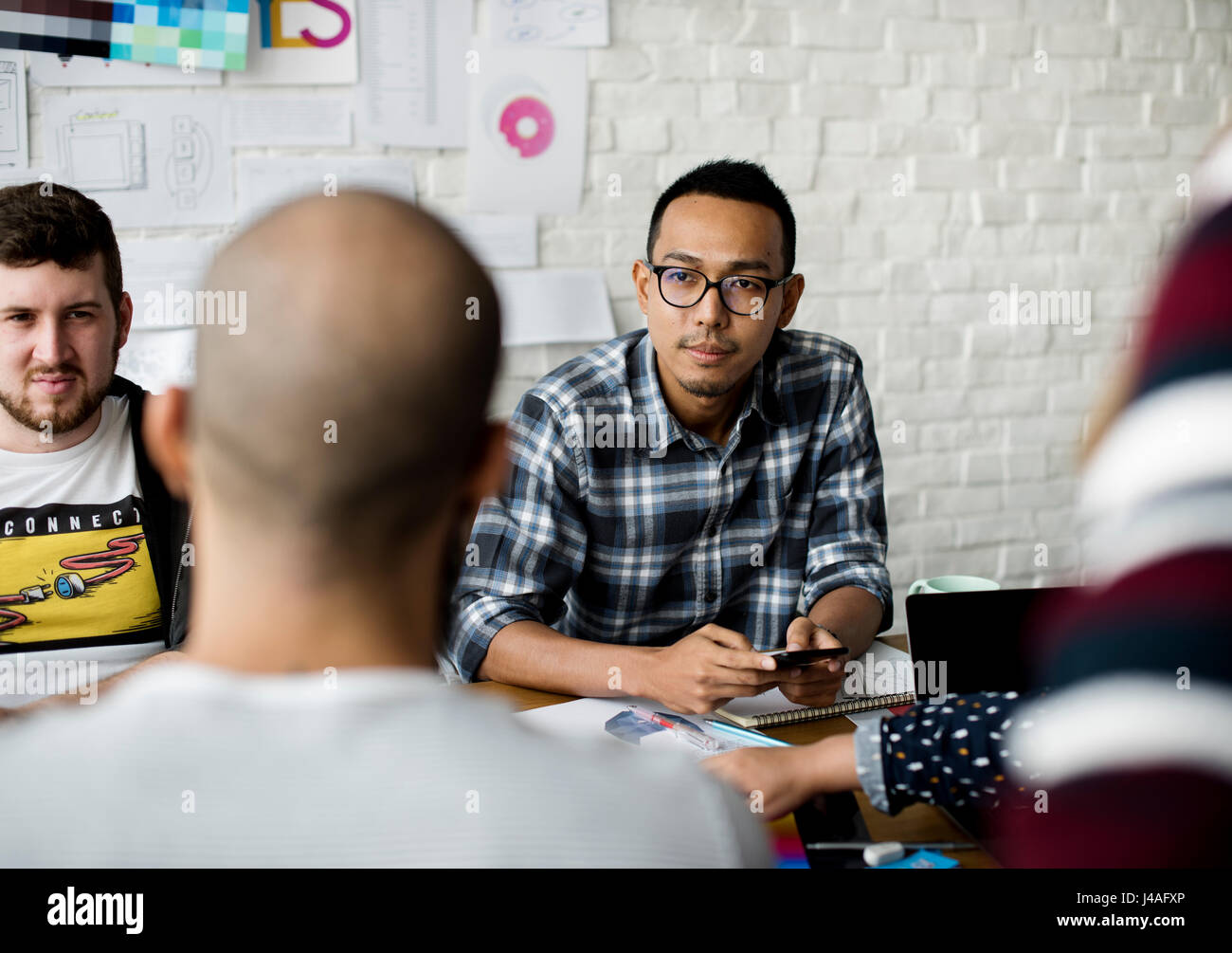 Group of colleagues people brainstorming Stock Photo - Alamy