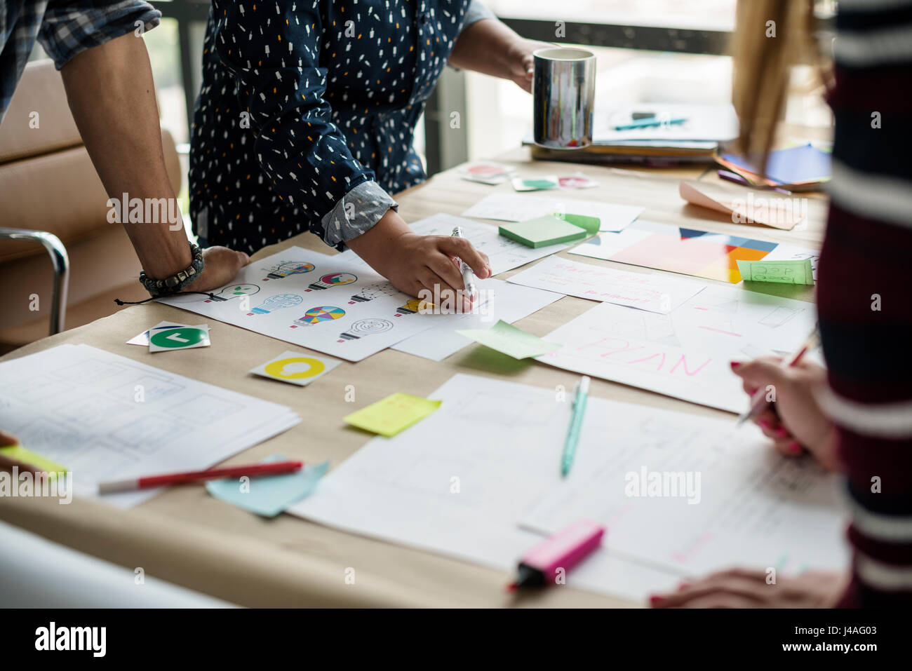 Group of colleagues people brainstorming Stock Photo - Alamy
