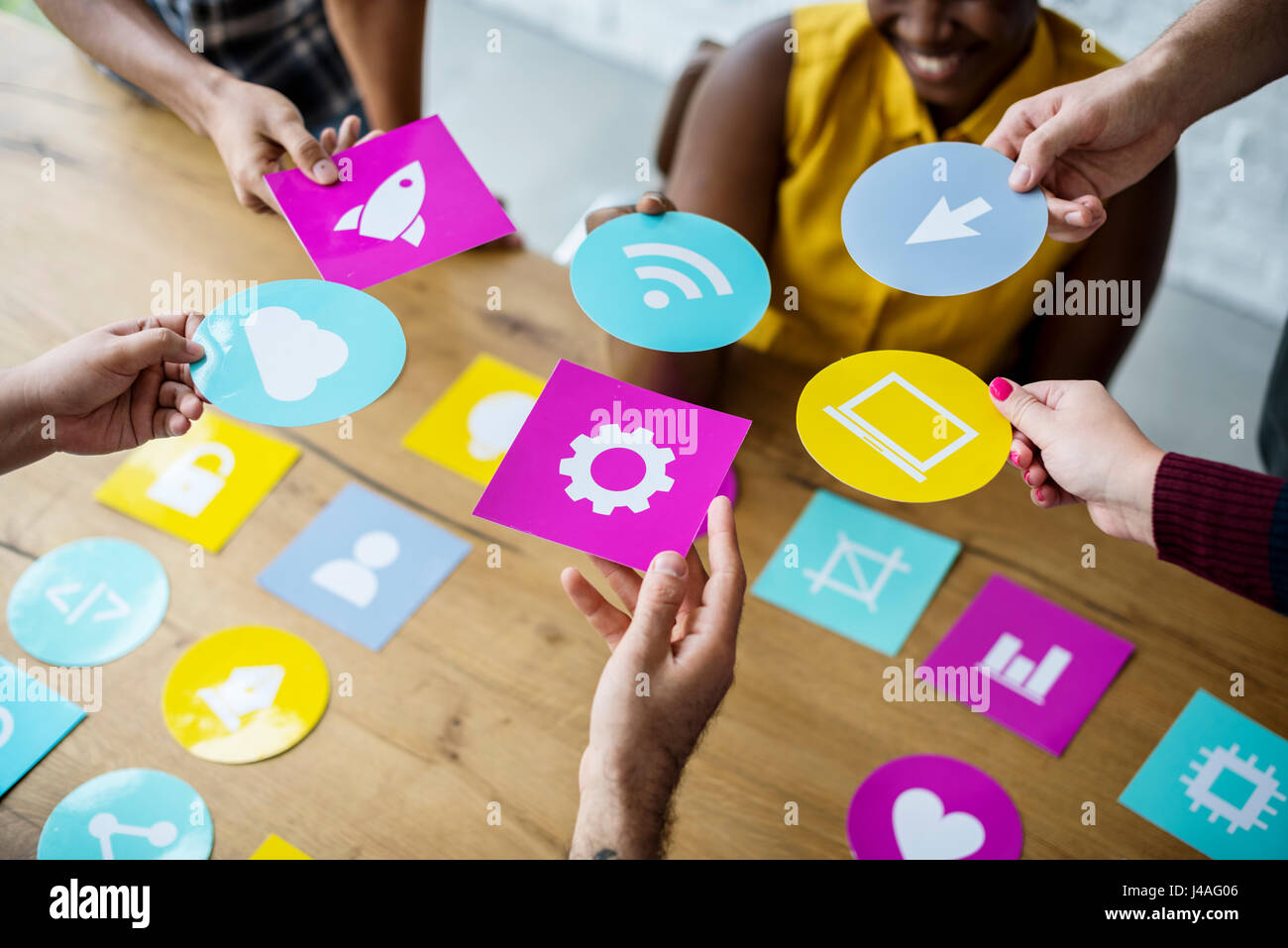 Group of computer icon on the wooden table Stock Photo - Alamy