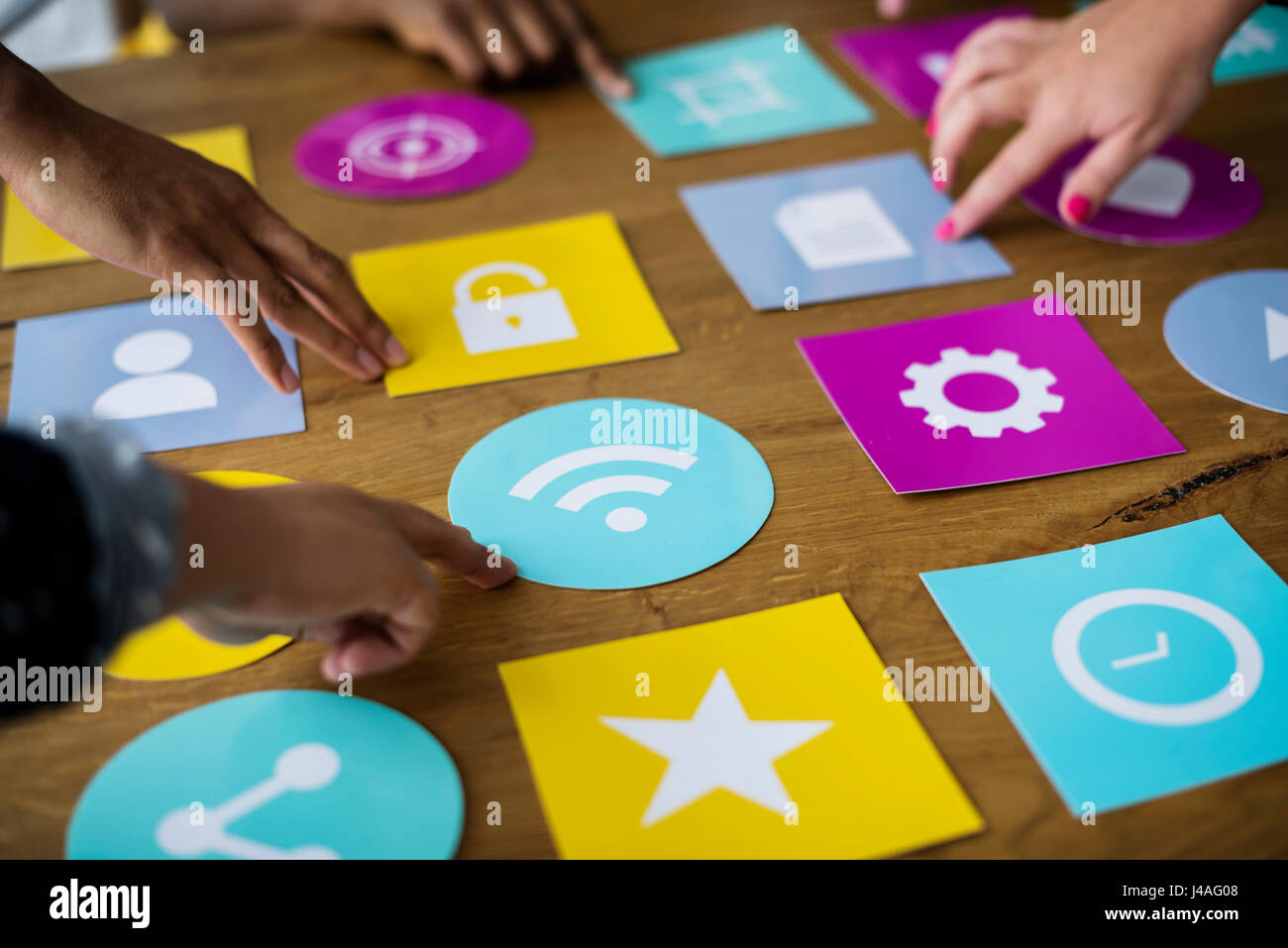 Group of computer icon on the wooden table Stock Photo - Alamy