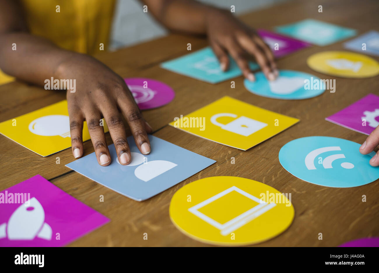 Group of computer icon on the wooden table Stock Photo - Alamy
