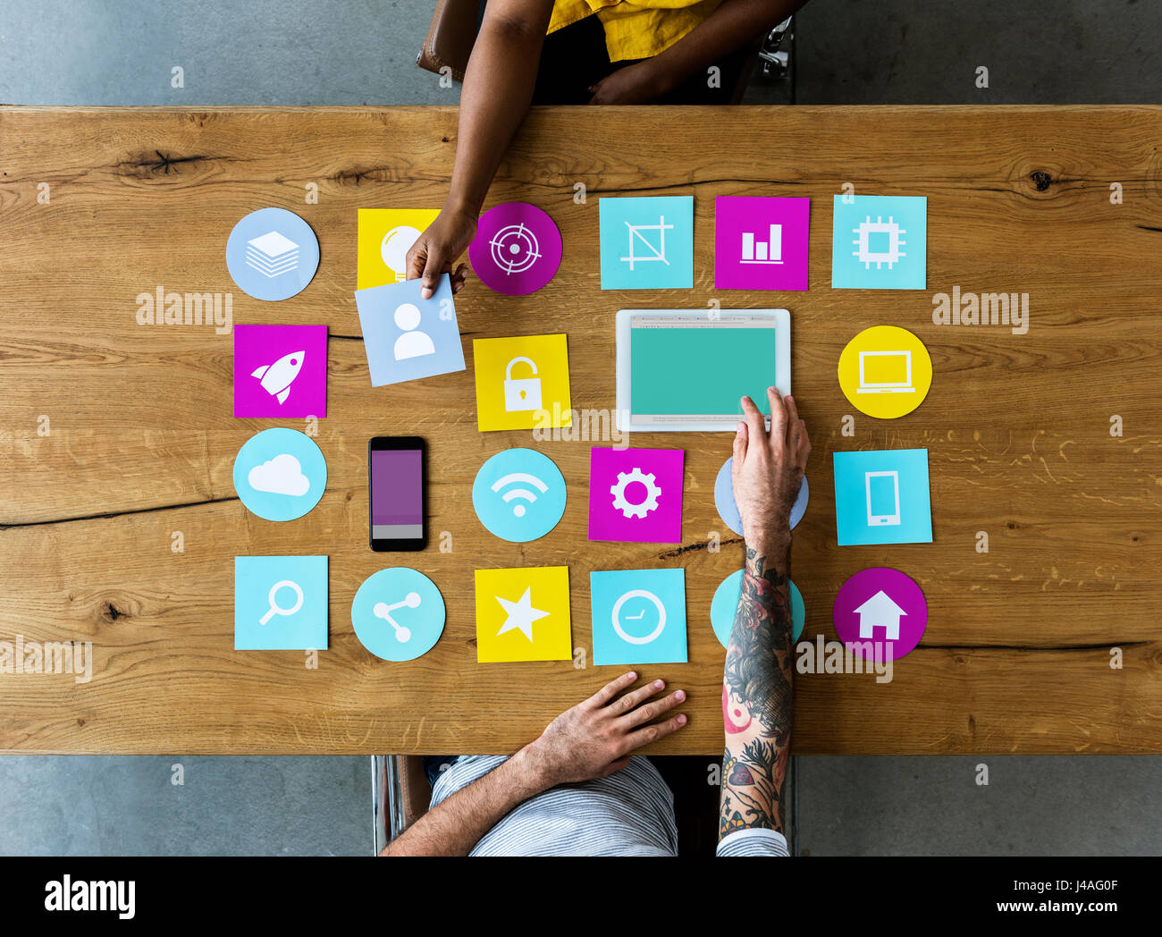 Group of computer icon on the wooden table Stock Photo - Alamy