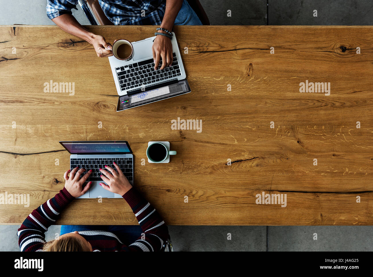Colleagues working together aerial view hi-res stock photography and ...