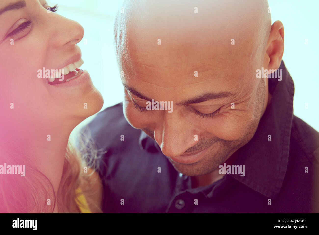Close up of woman and boyfriend laughing Stock Photo - Alamy