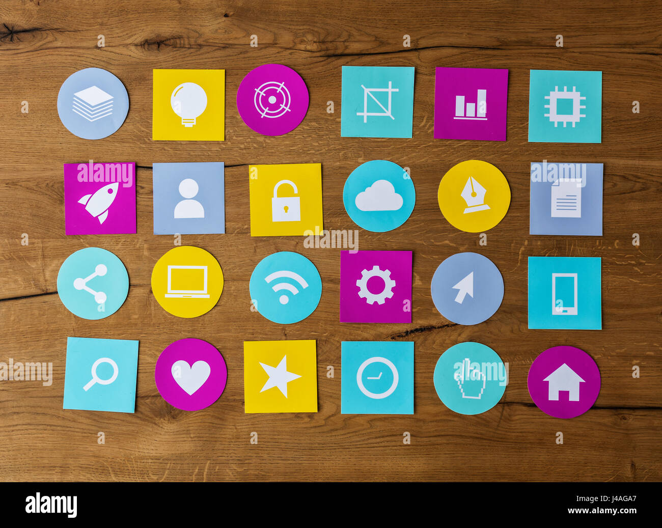 Group of computer icon on the wooden table Stock Photo - Alamy